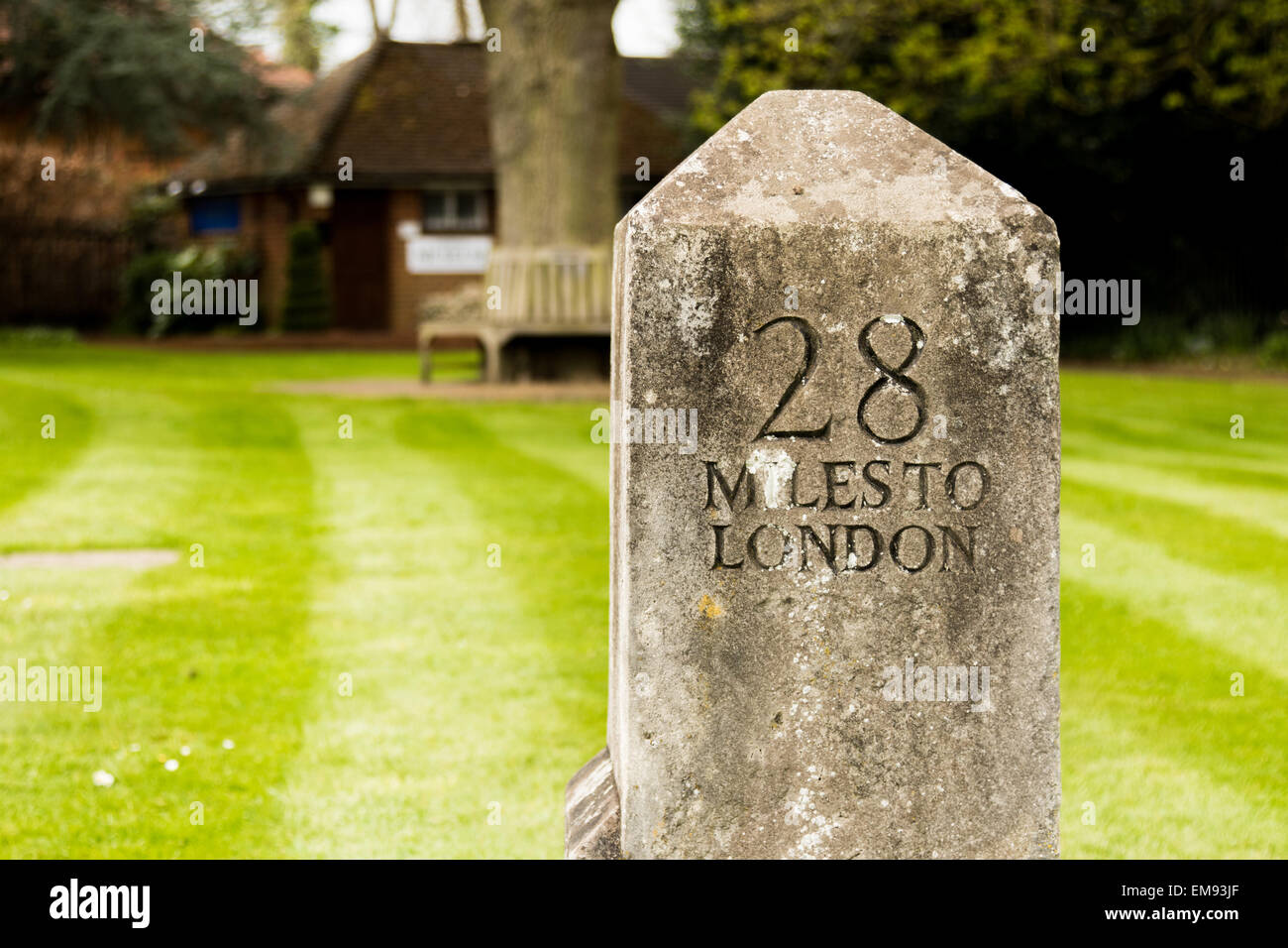 Mile Stone in Chobham UK reading 28 Miles to London Stock Photo - Alamy