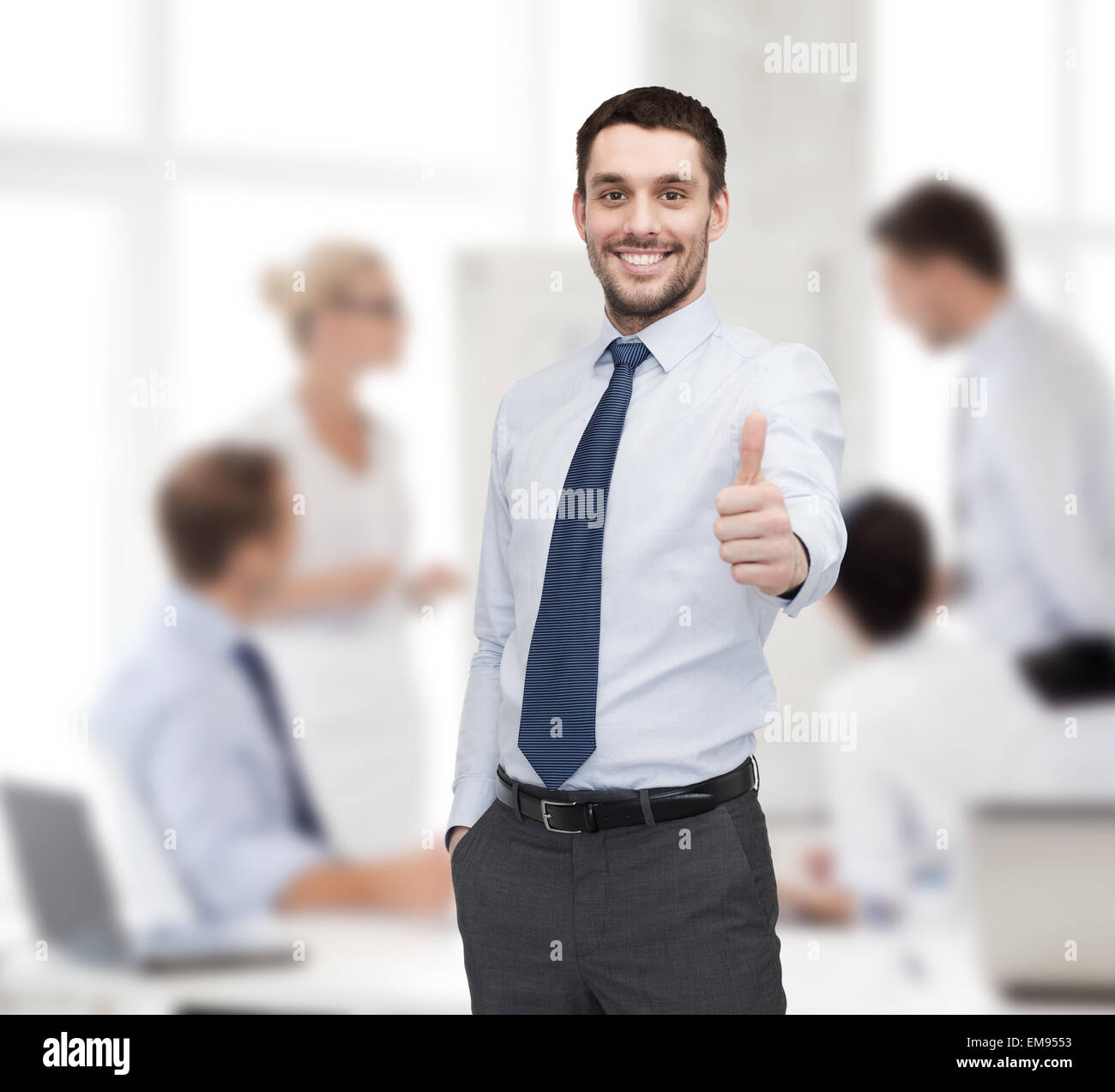 handsome businessman showing thumbs up Stock Photo - Alamy