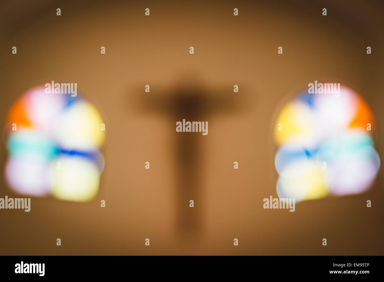 cross and stained glass window in the church blur abstract background ...