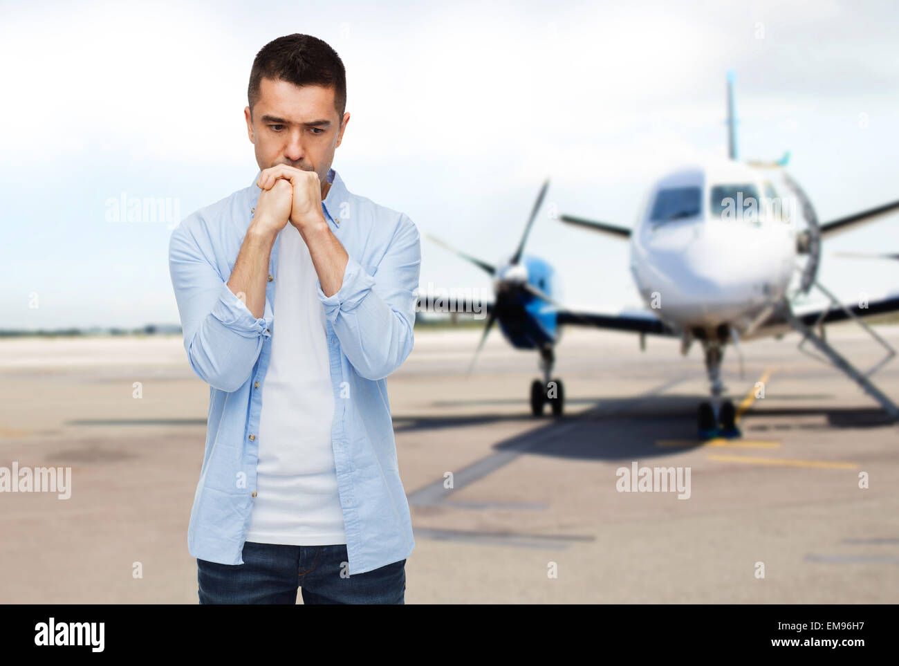 man thinking over airplane on runway background Stock Photo - Alamy