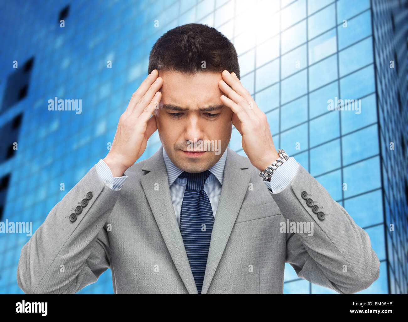 Businessman having headache touching head hi-res stock photography and ...