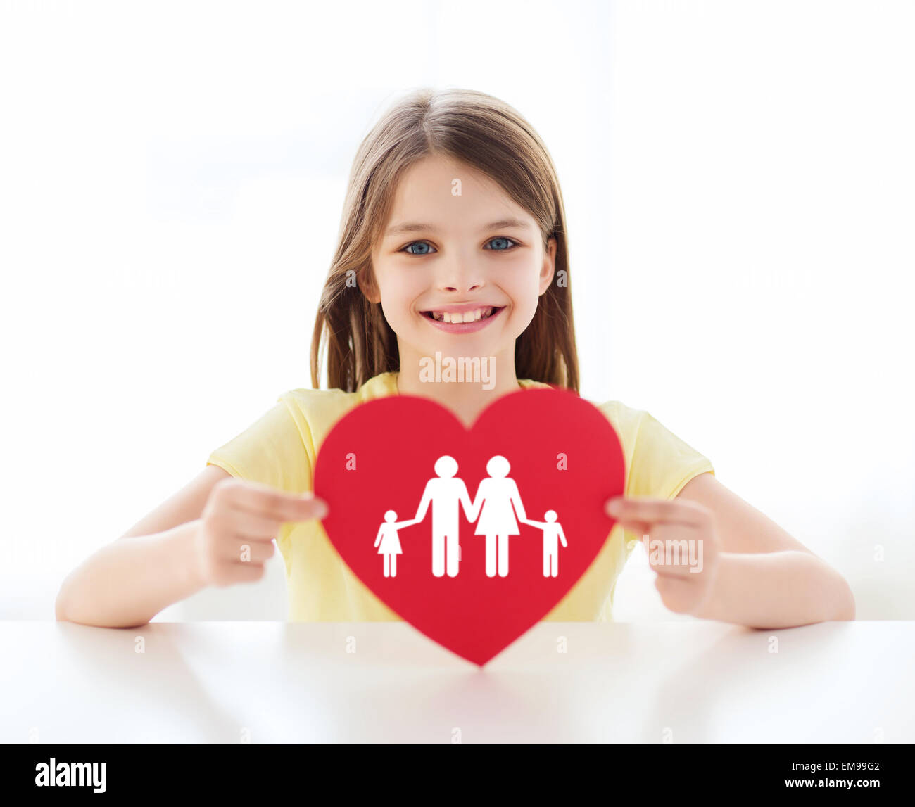 smiling little girl with red heart and family Stock Photo - Alamy