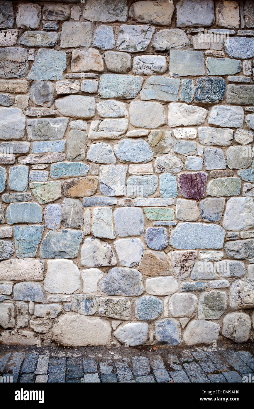 Wall of stones and pavement Stock Photo - Alamy