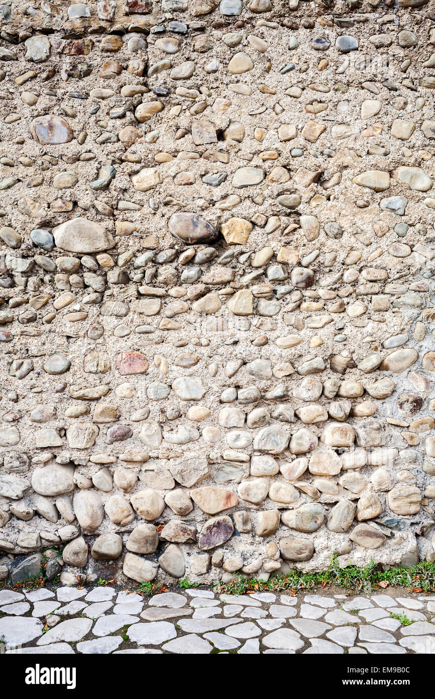 Wall of stones and pavement Stock Photo - Alamy