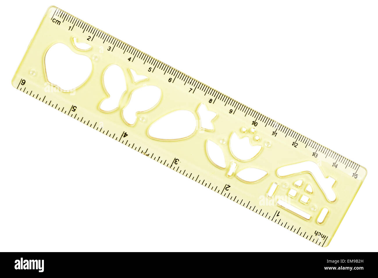 Yellow plastic ruler and stencil isolated on white Stock Photo - Alamy