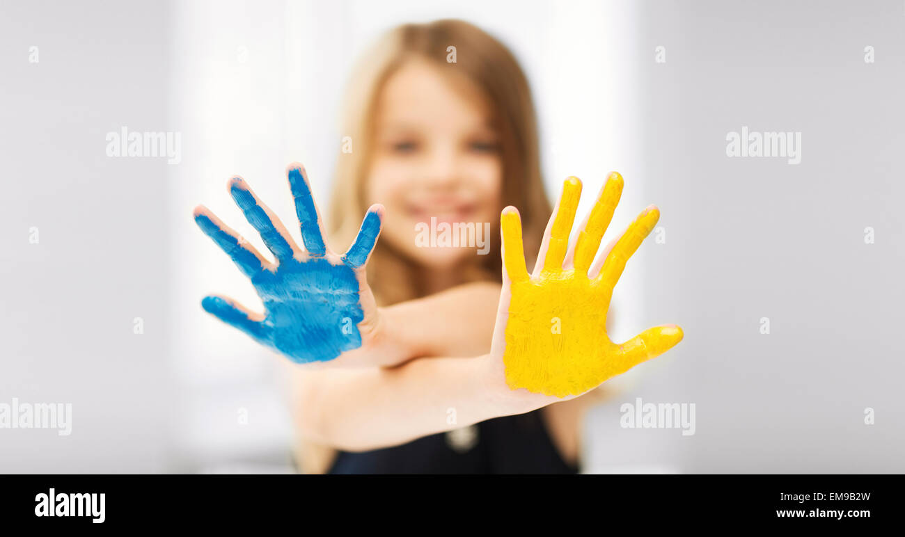 girl showing painted hands Stock Photo - Alamy