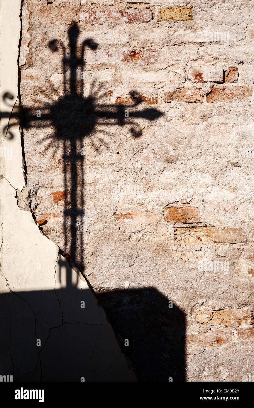 Shadow of a cross on a wall Stock Photo - Alamy