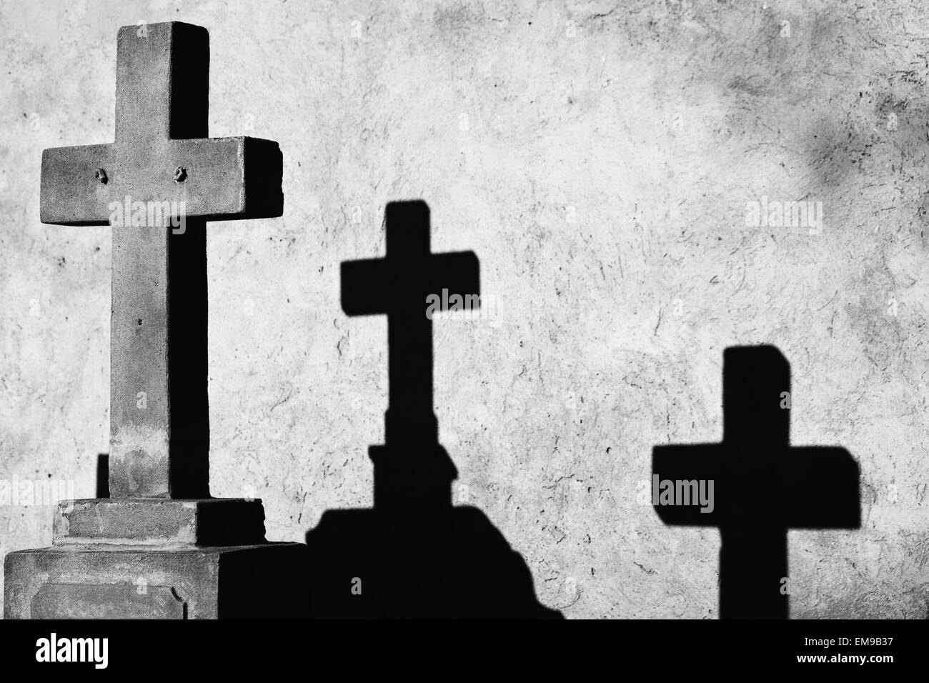 Cross and two shadows on a wall, monochrome image Stock Photo - Alamy