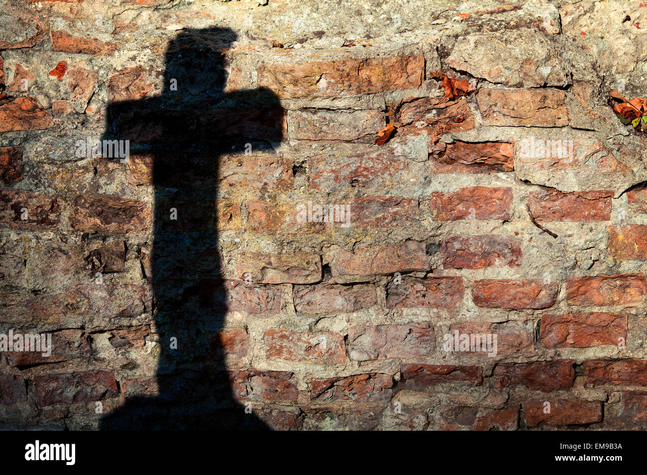 Shadow of a cross on a wall Stock Photo - Alamy