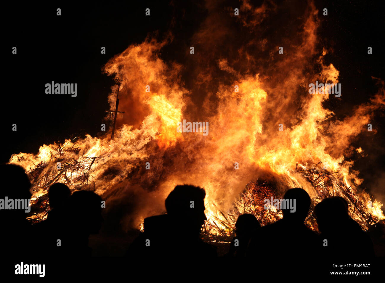 People look at the traditional Easter bonfire in the Lusatian village ...
