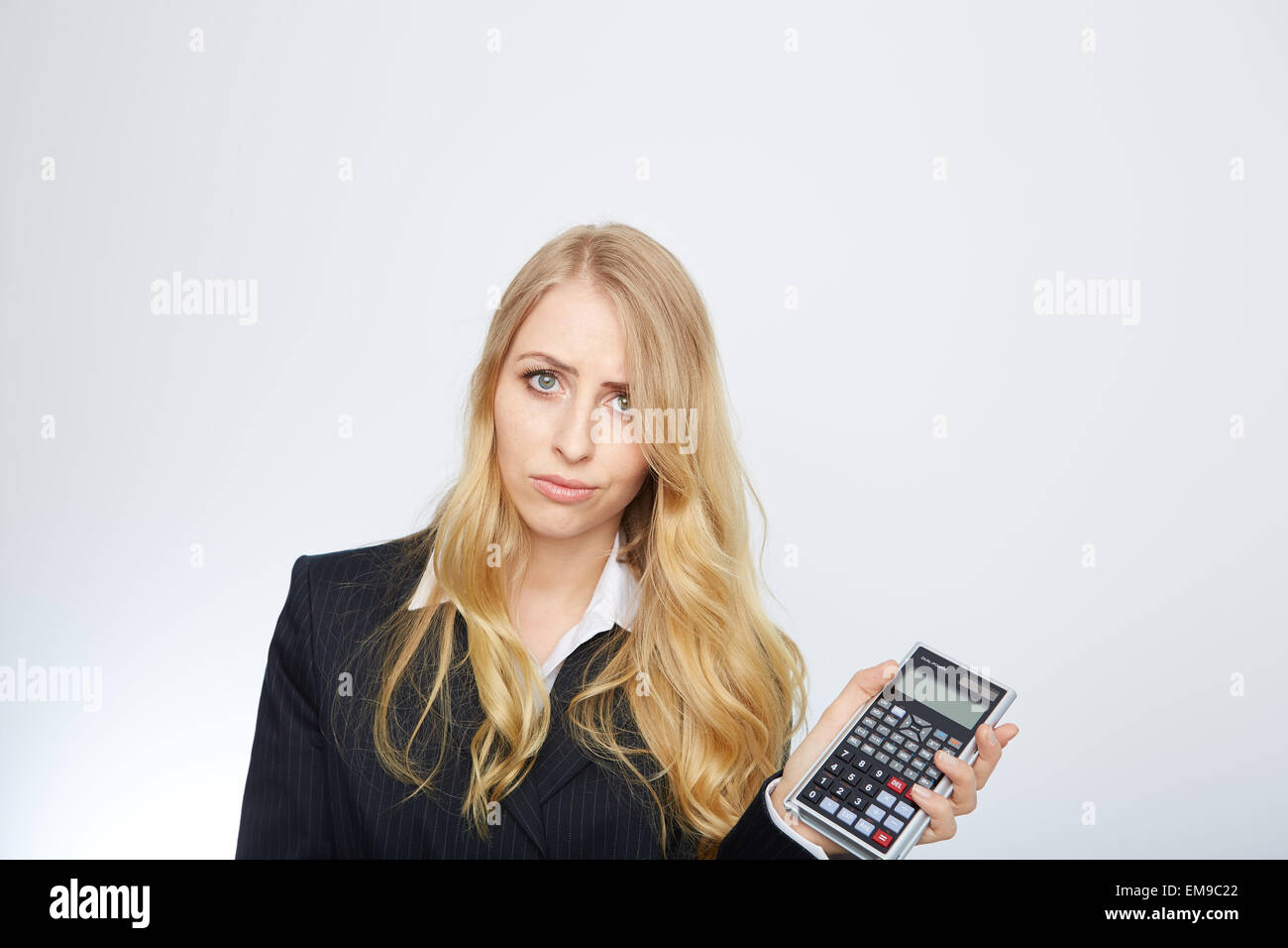 attractive smiling business woman with calculator Stock Photo - Alamy