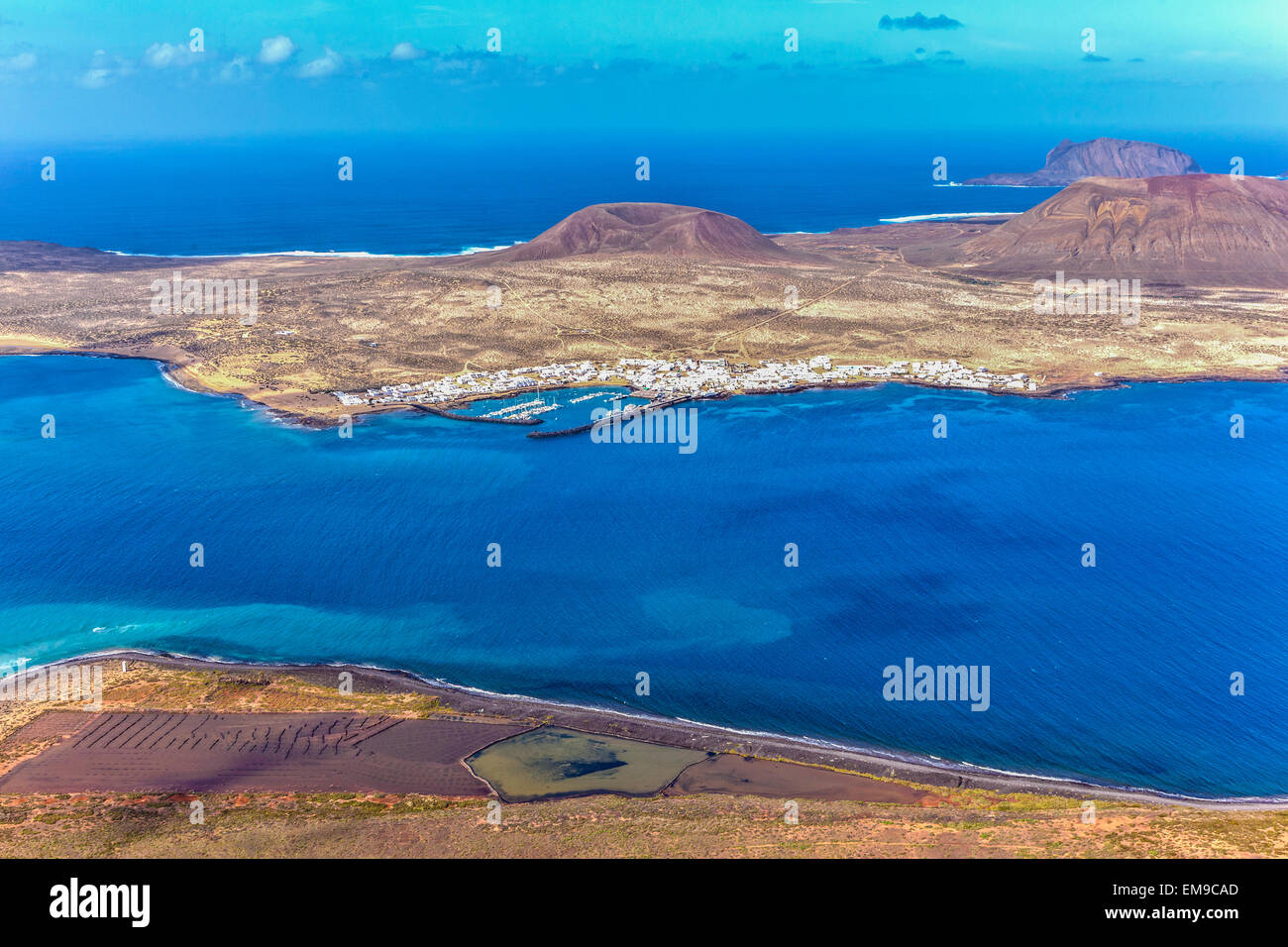 The Island of La Graciosa and the port of Caleta del Sebo taken from ...