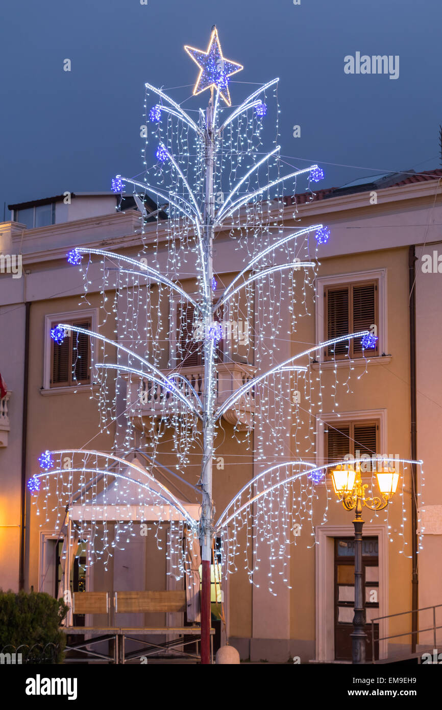 Noel Tree with colorful light in a town square Stock Photo - Alamy