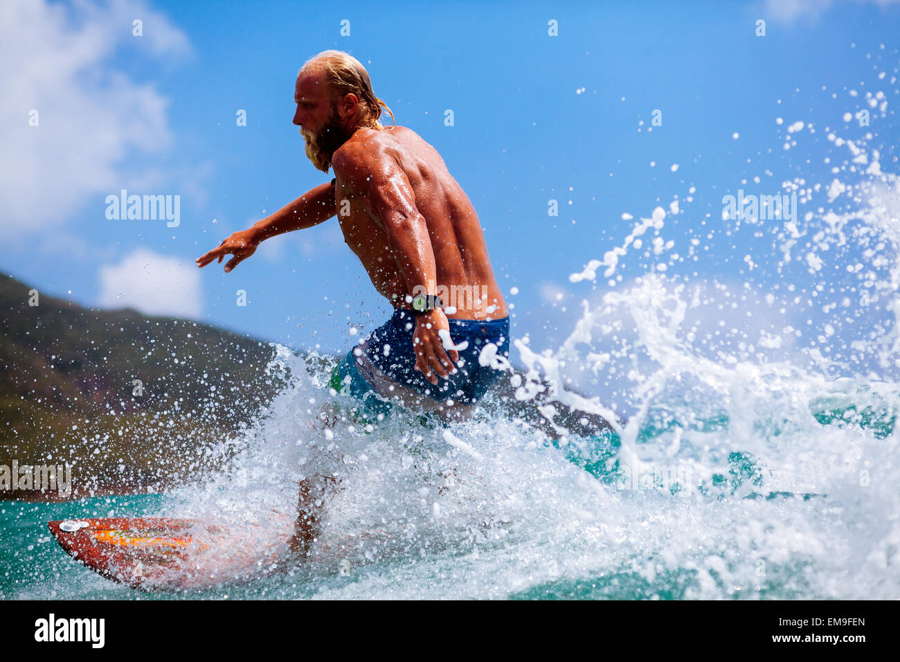 man with beard surfing wave splash actively Stock Photo - Alamy
