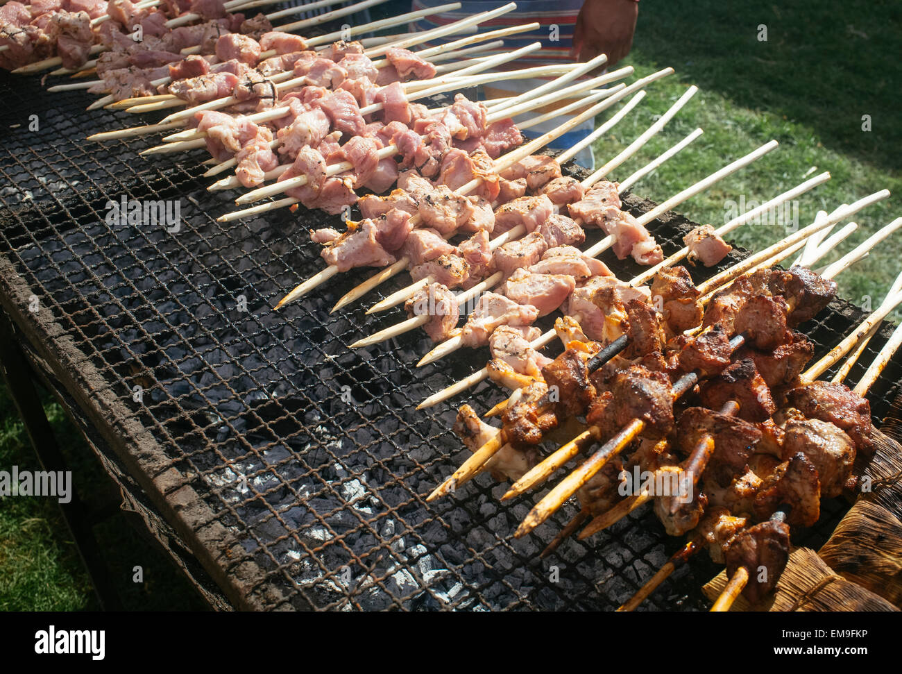 skewers of grilled meat on grill typical Chilean native fiestas Stock ...