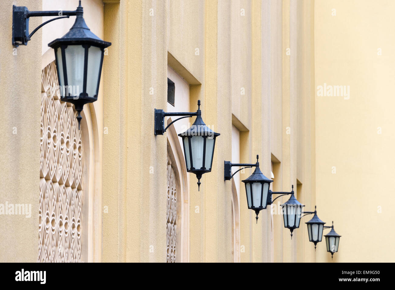 Series of lanterns on a yellow wall, Dubai, United Arab Emirates Stock ...