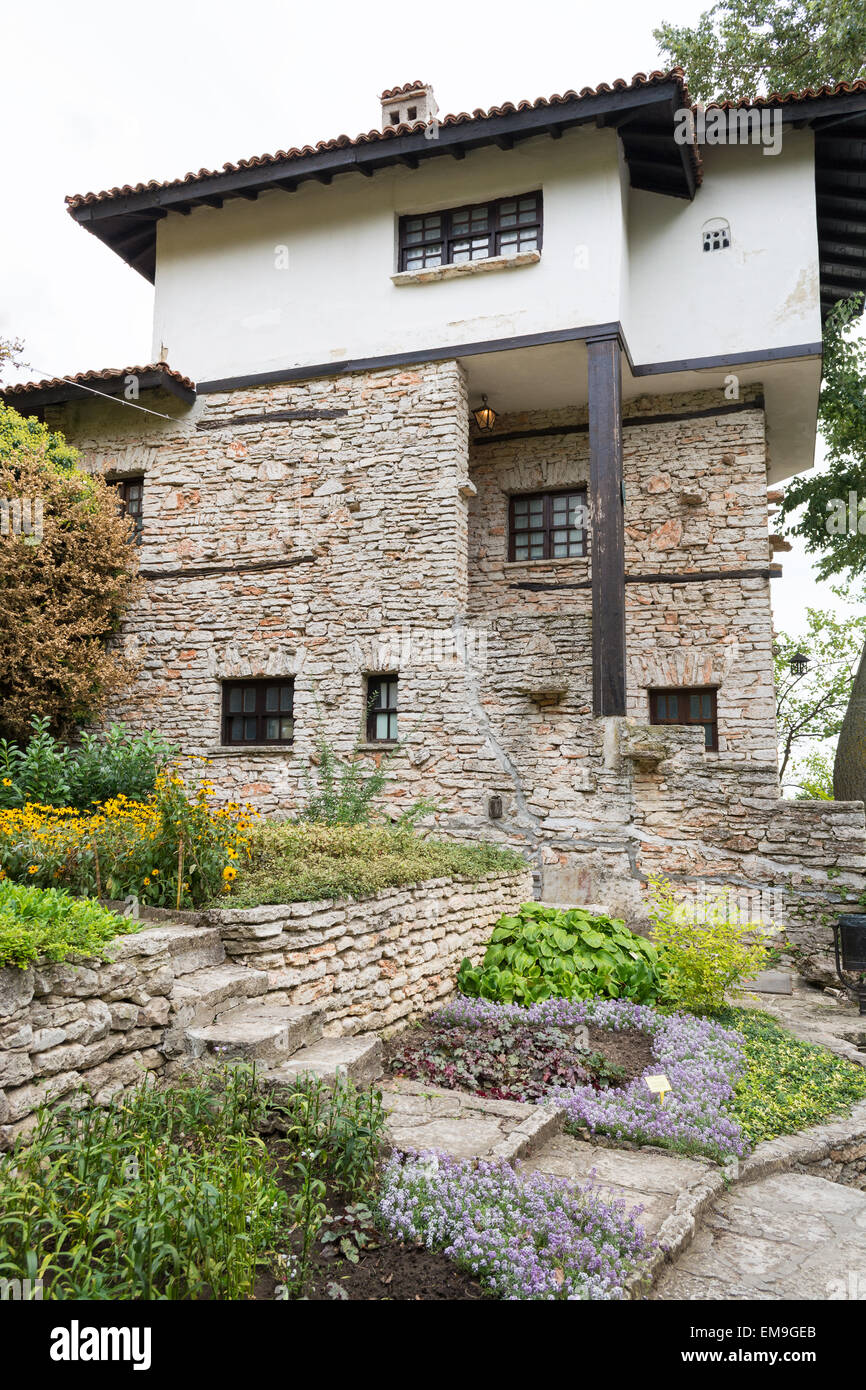 Typical old Bulgarian architecture of the house with a stone wall on ...
