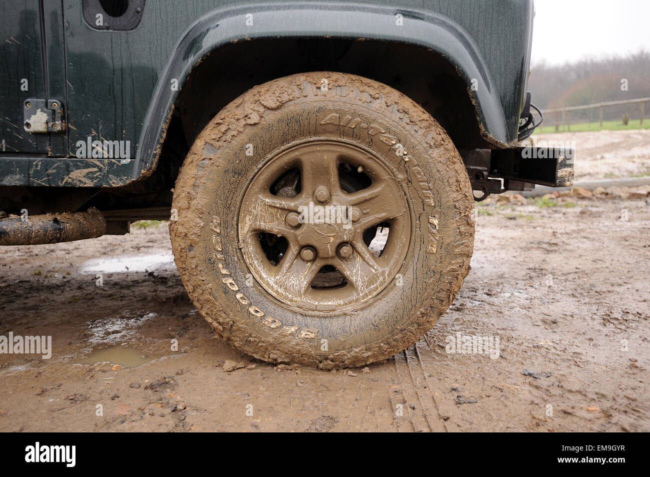 Land Rover Defender wheel off road covered in mud Stock Photo - Alamy