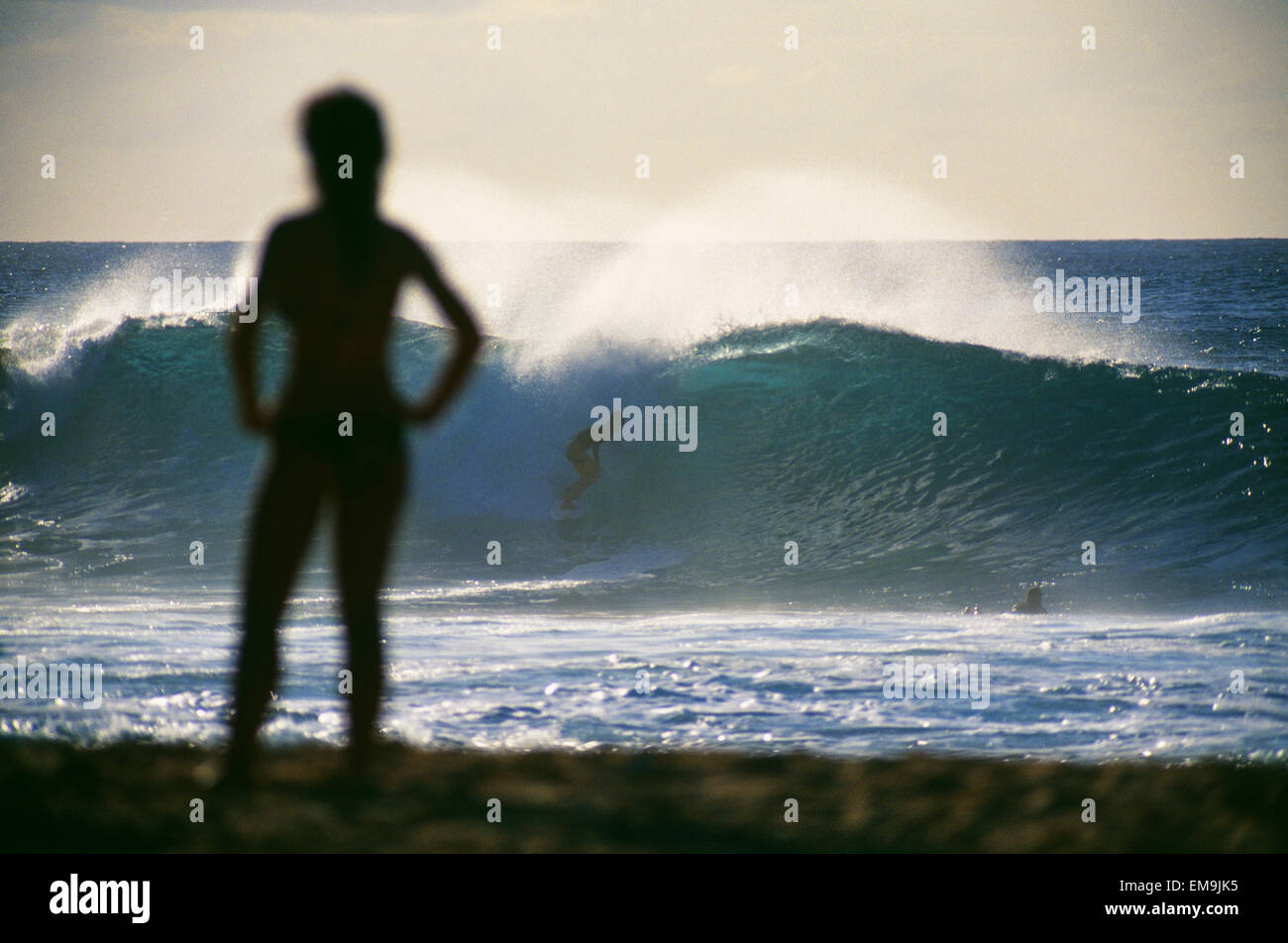 Sihouette Of Person Standing On The Beach At Pipeline Watching Surfer ...