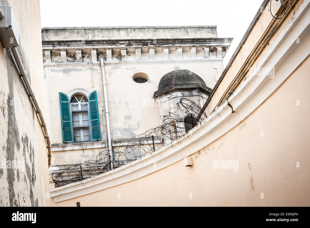Curve of barbed wire. Surrounding wall Stock Photo - Alamy