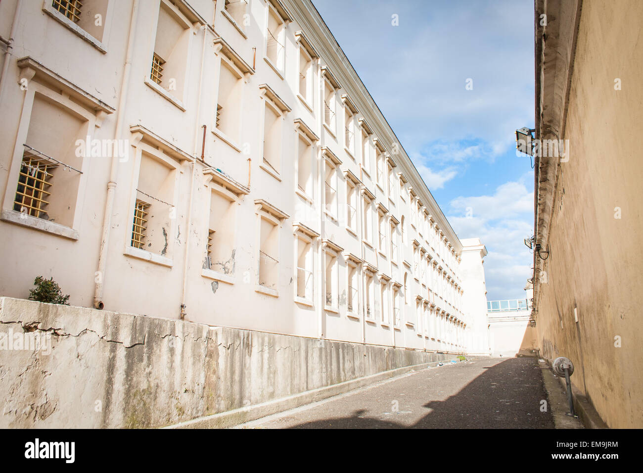 Row of windows with bars in old prison Stock Photo - Alamy