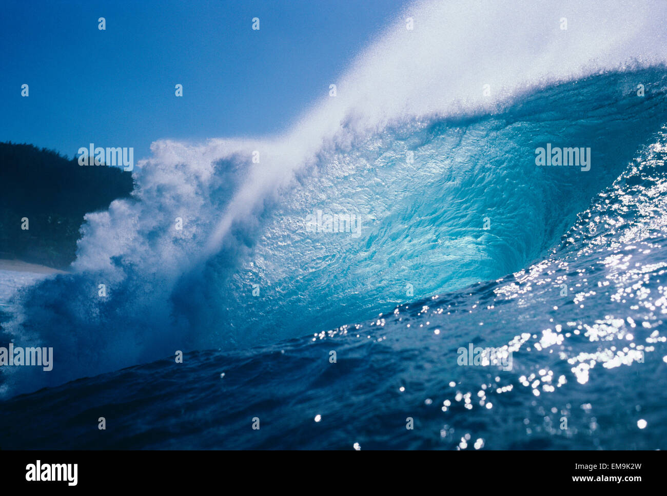 Side View Of Huge Wave Crashing With Windspray, Shimmery Water ...