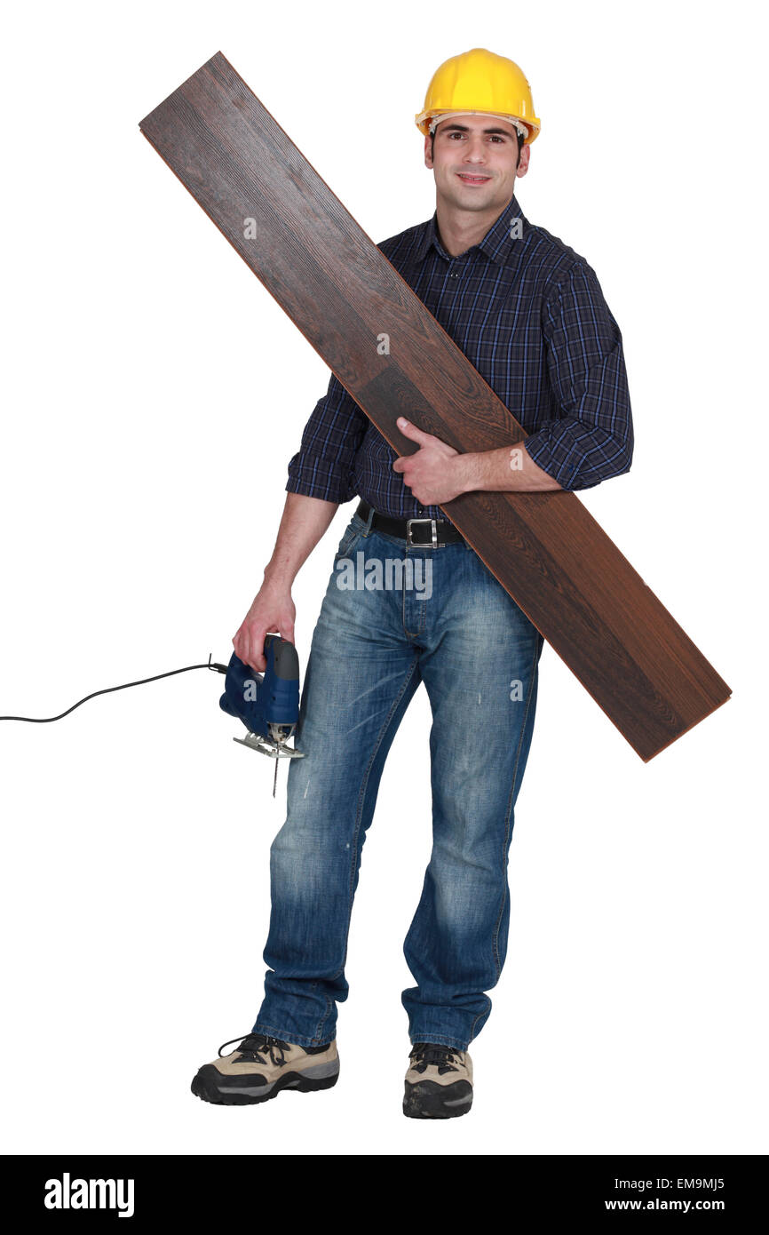 Carpenter with electric saw Stock Photo - Alamy