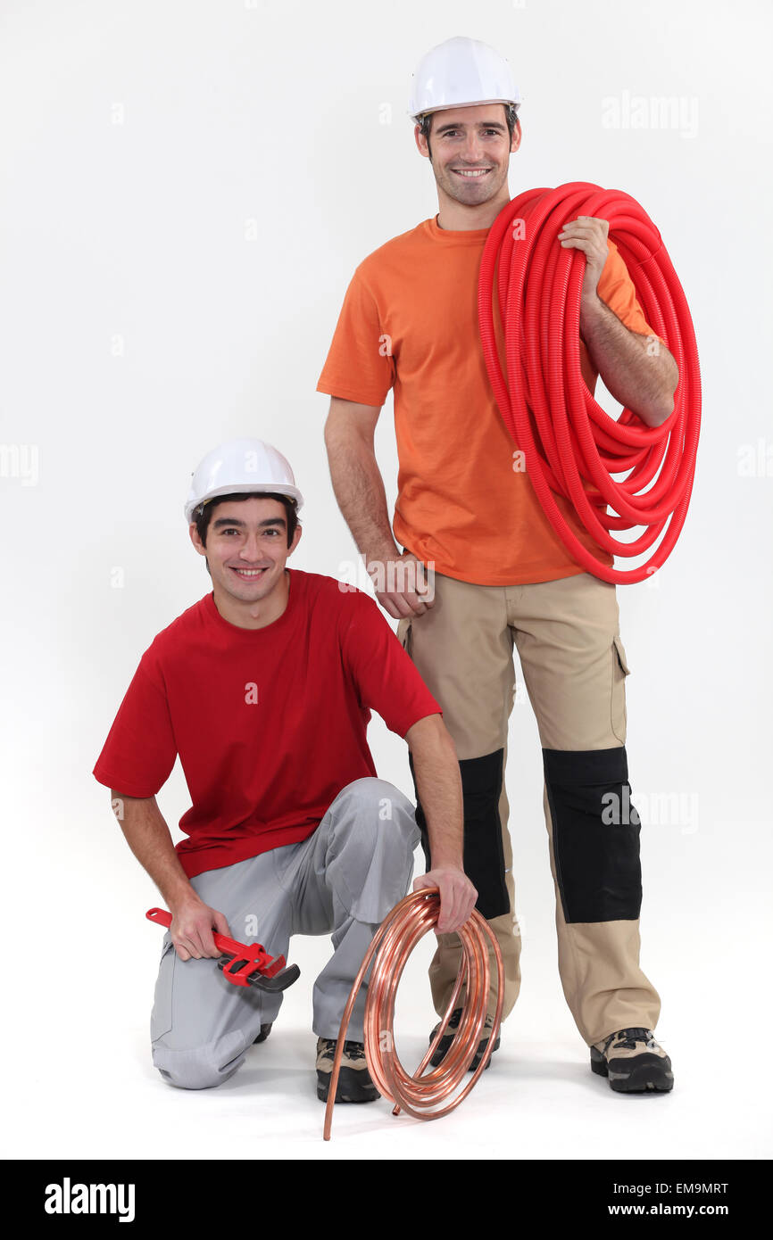 duo of cheerful plumbers Stock Photo - Alamy