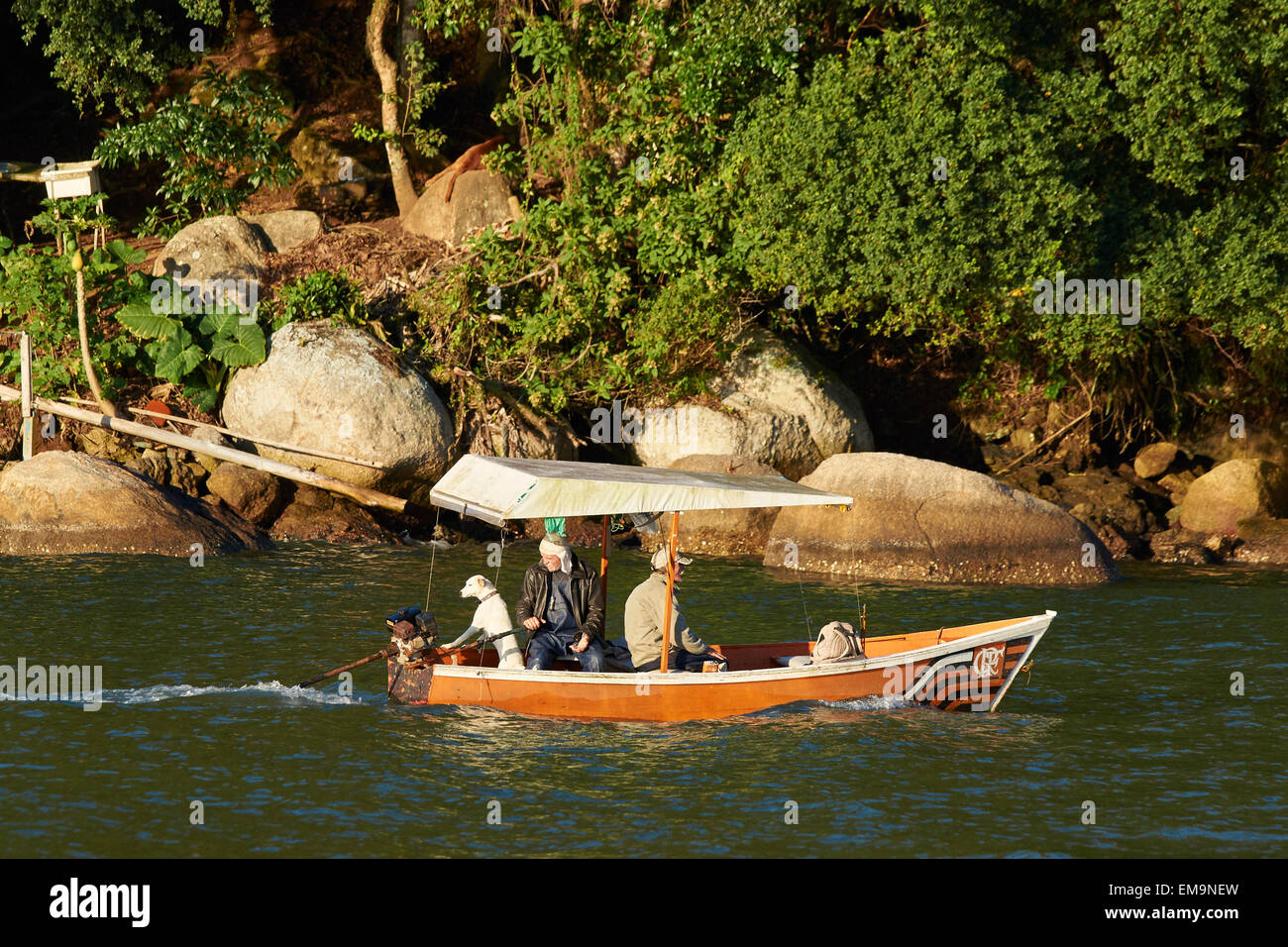 Fisherman with his best friends Stock Photo - Alamy