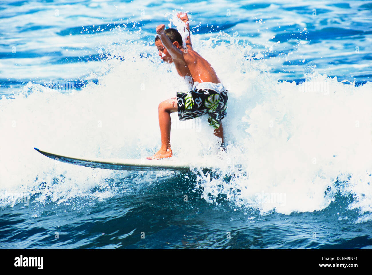 Hawaii, Oahu, Young Boy In Surfing With Arms Raised Stock Photo - Alamy