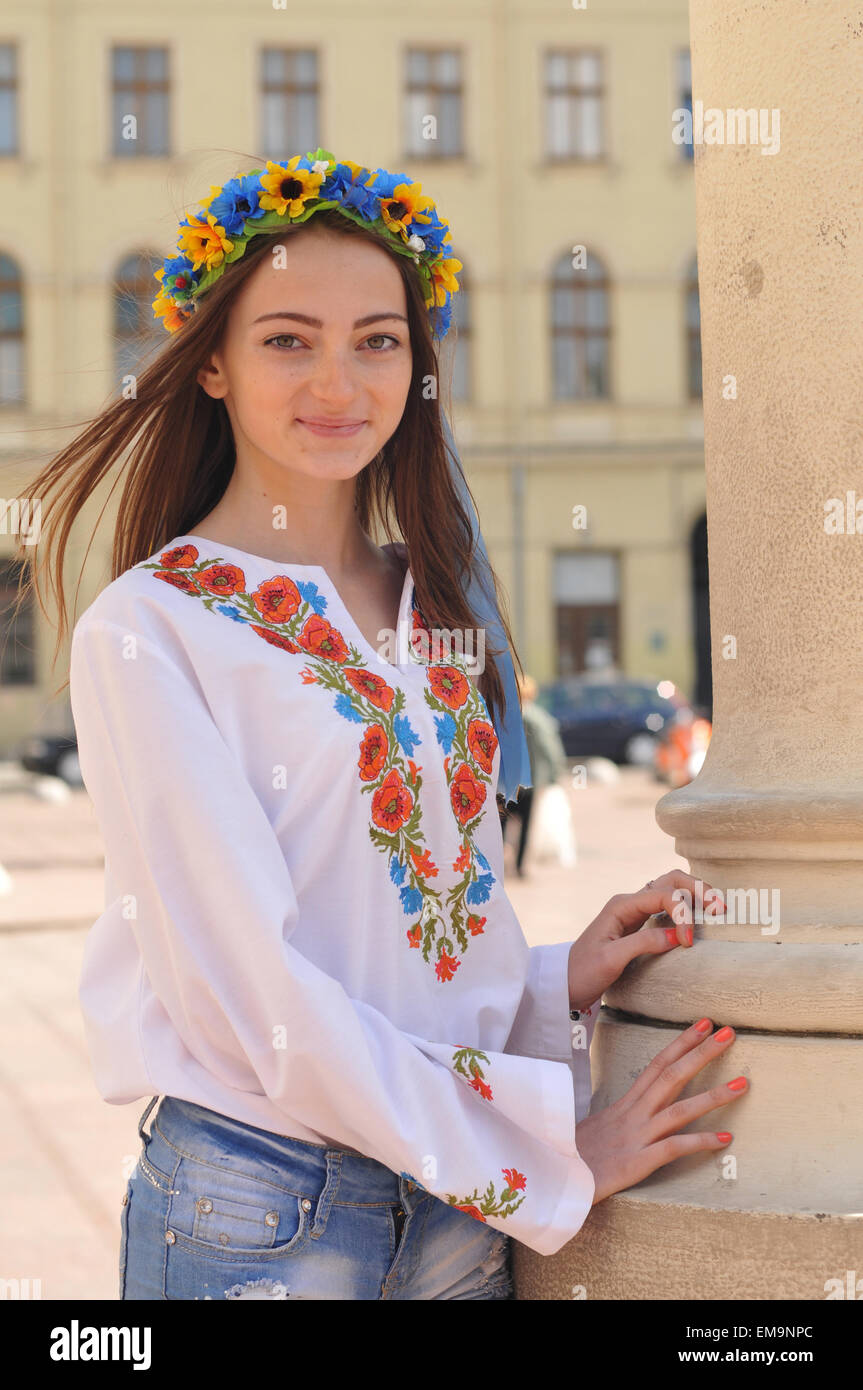 Pretty ukrainian girl stands and looking at camera. She is wearing ...
