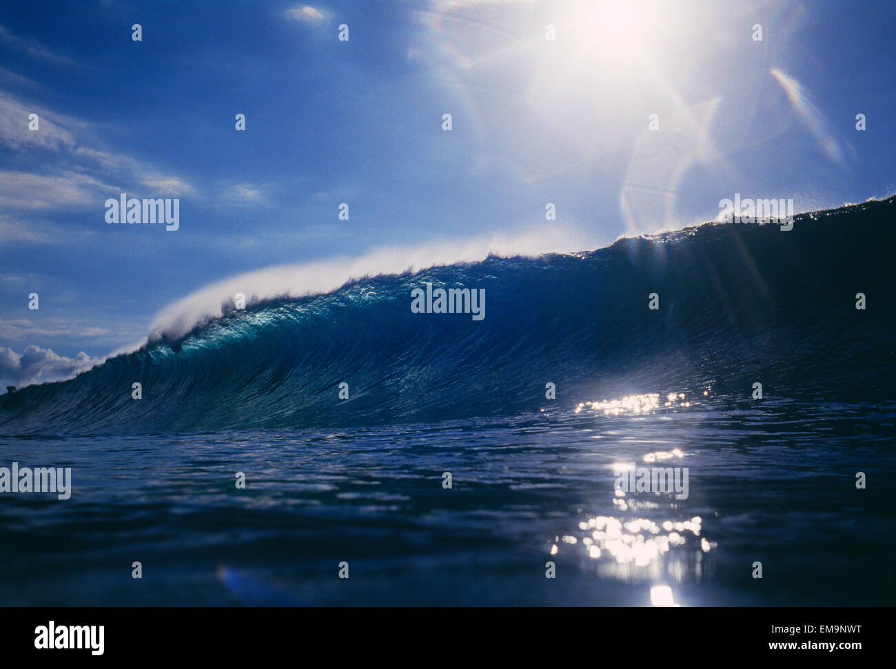 Hawaii, Oahu, North Shore, Pipeline Wave, Sunburst Above Stock Photo ...