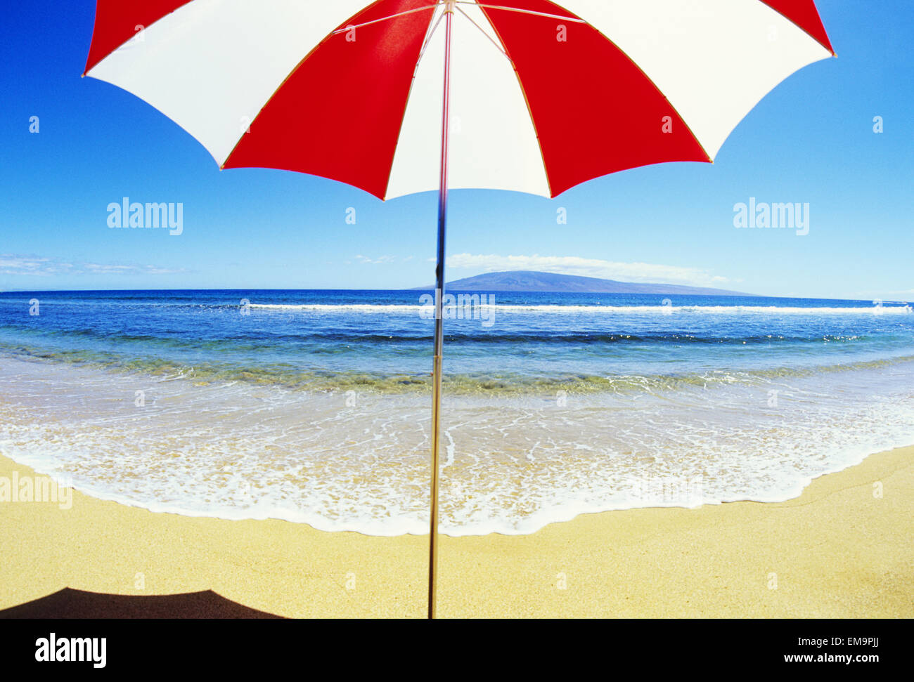 Red And White Umbrella On The Beach, Blue Sky And Ocean Stock Photo - Alamy