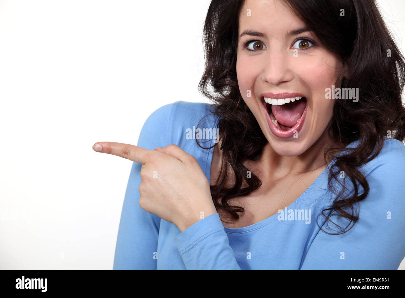Woman pointing in delight Stock Photo - Alamy