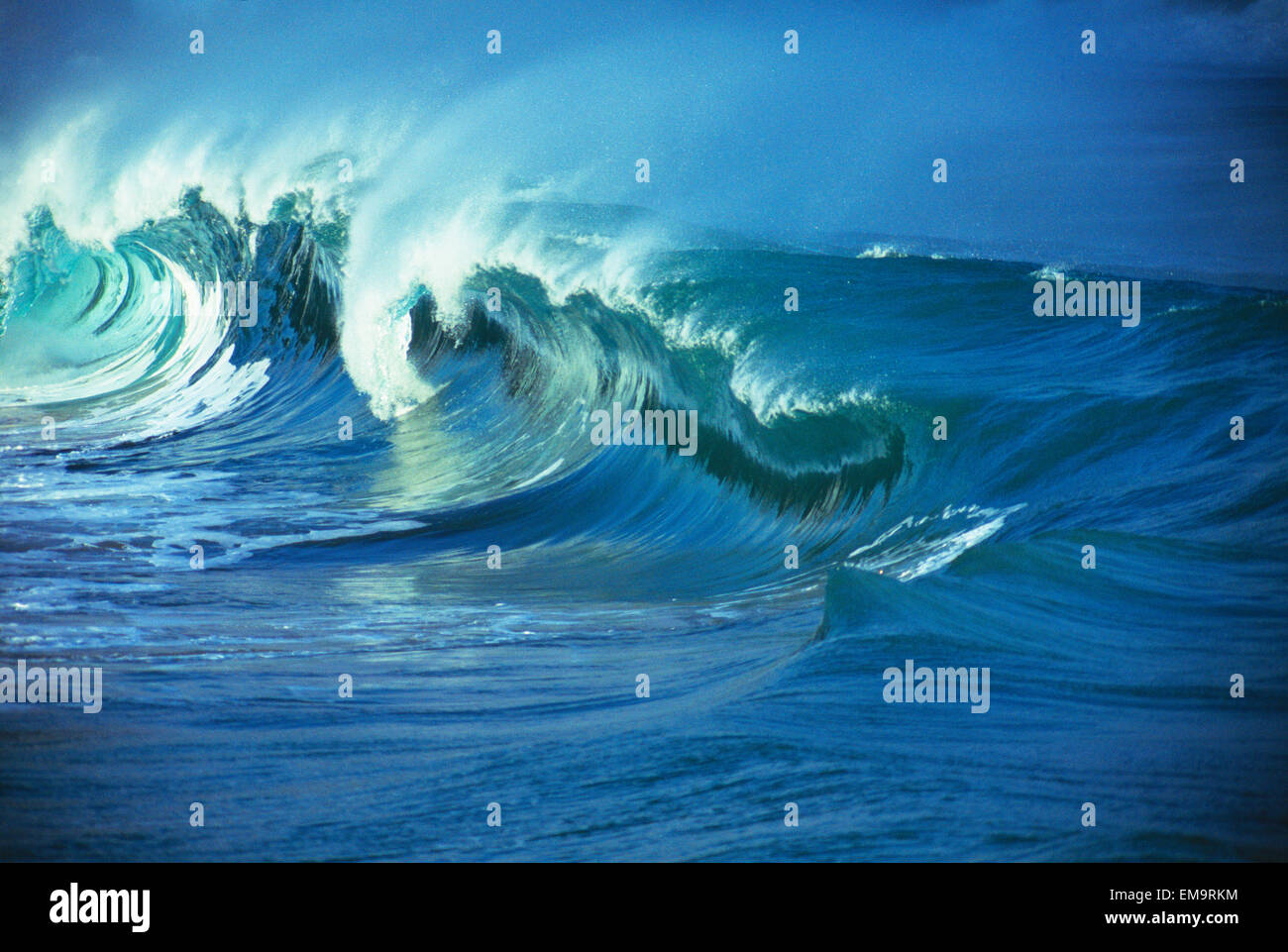 Rough Seas, Large Curling Waves And Cloudy Sky Stock Photo - Alamy