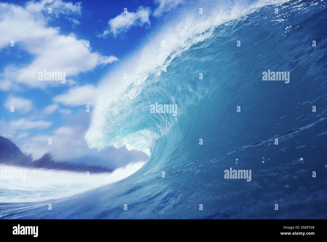 Side View Of Blue, Curling Wave, Background Blurred By Mist Stock Photo ...