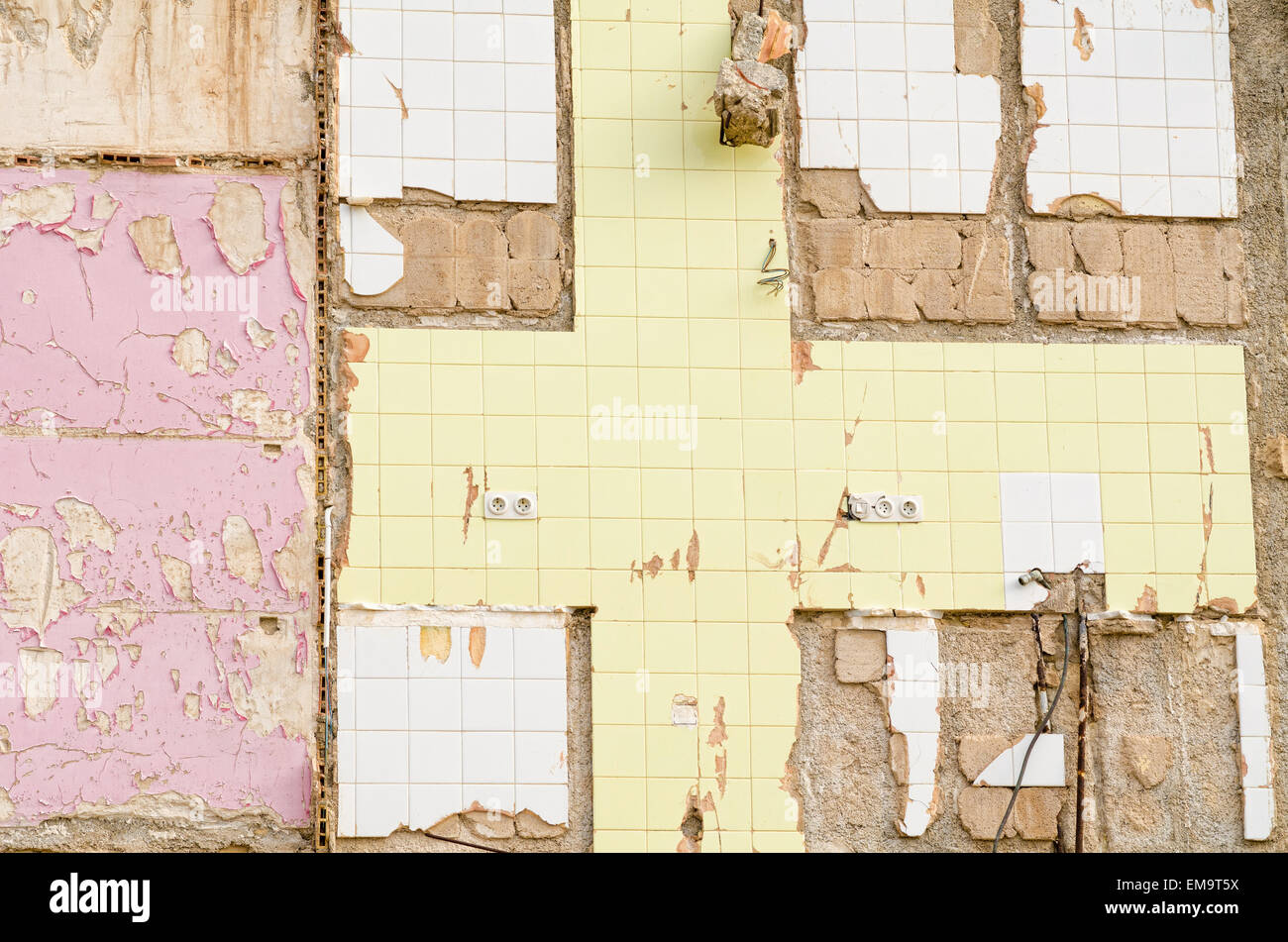 Patches of tiles and bricks left on a demolished wall Stock Photo - Alamy
