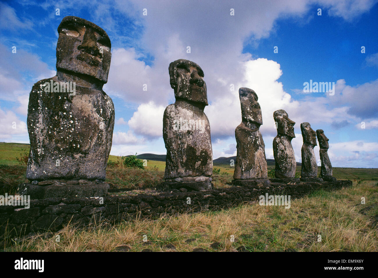 Easter Island, Line Of Ancient Stone Statues, Cloudy Blue Sky Stock ...