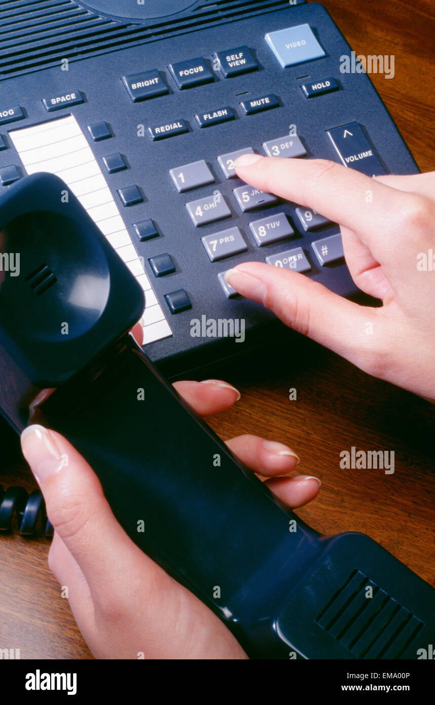 Closeup Of Womans Hand Dialing Telephone Stock Photo - Alamy