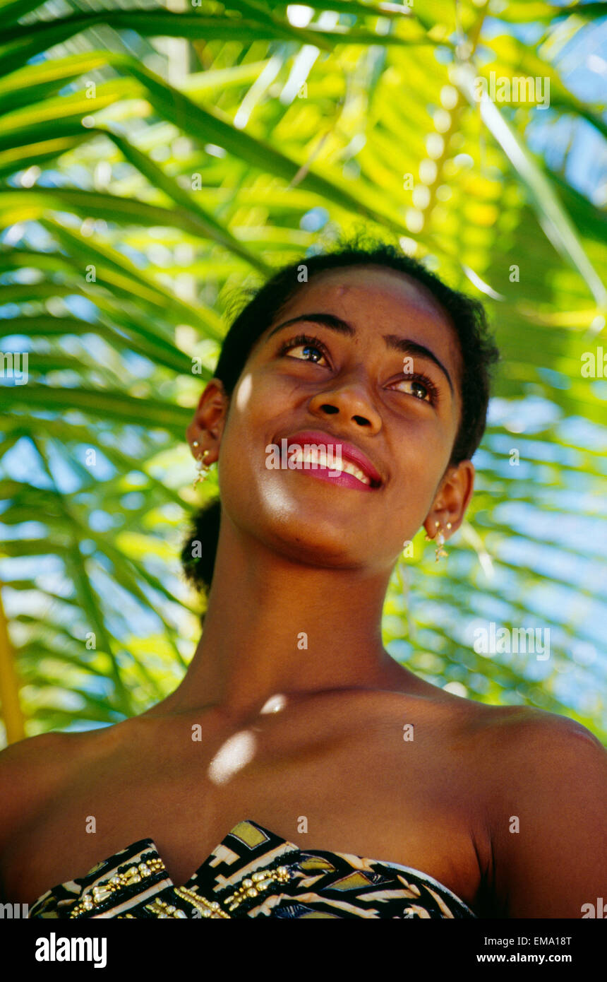 Fiji, Smiling Young Fijian Woman In Strapless Dress, Palm Fronds In ...