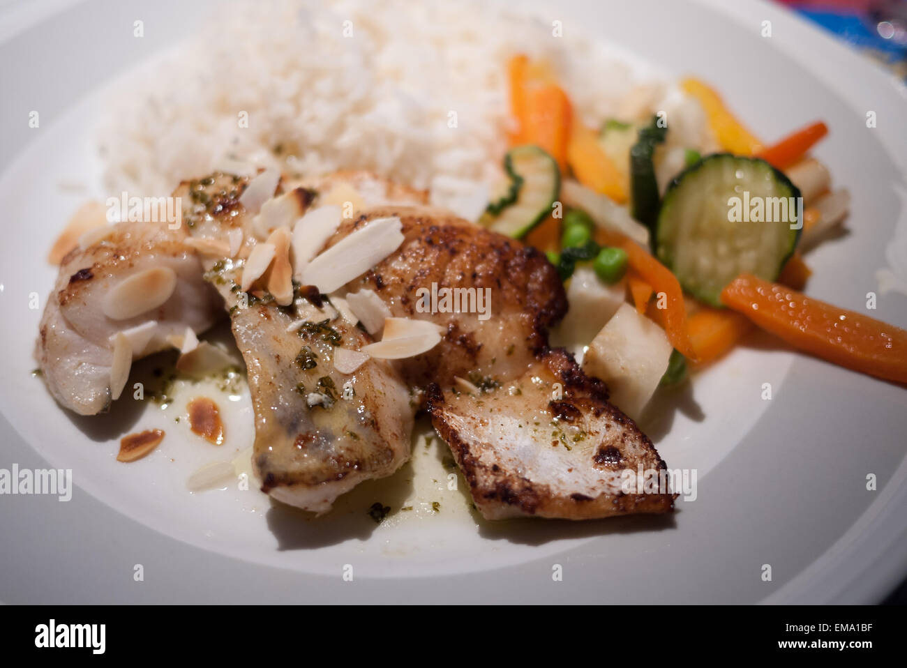 Fish dish with rice Stock Photo - Alamy