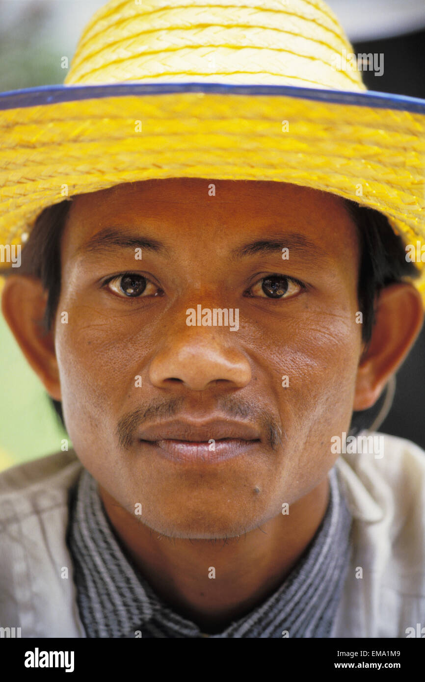 Thailand, Portrait Of Native Man Wearing Straw Hat No Model Release ...