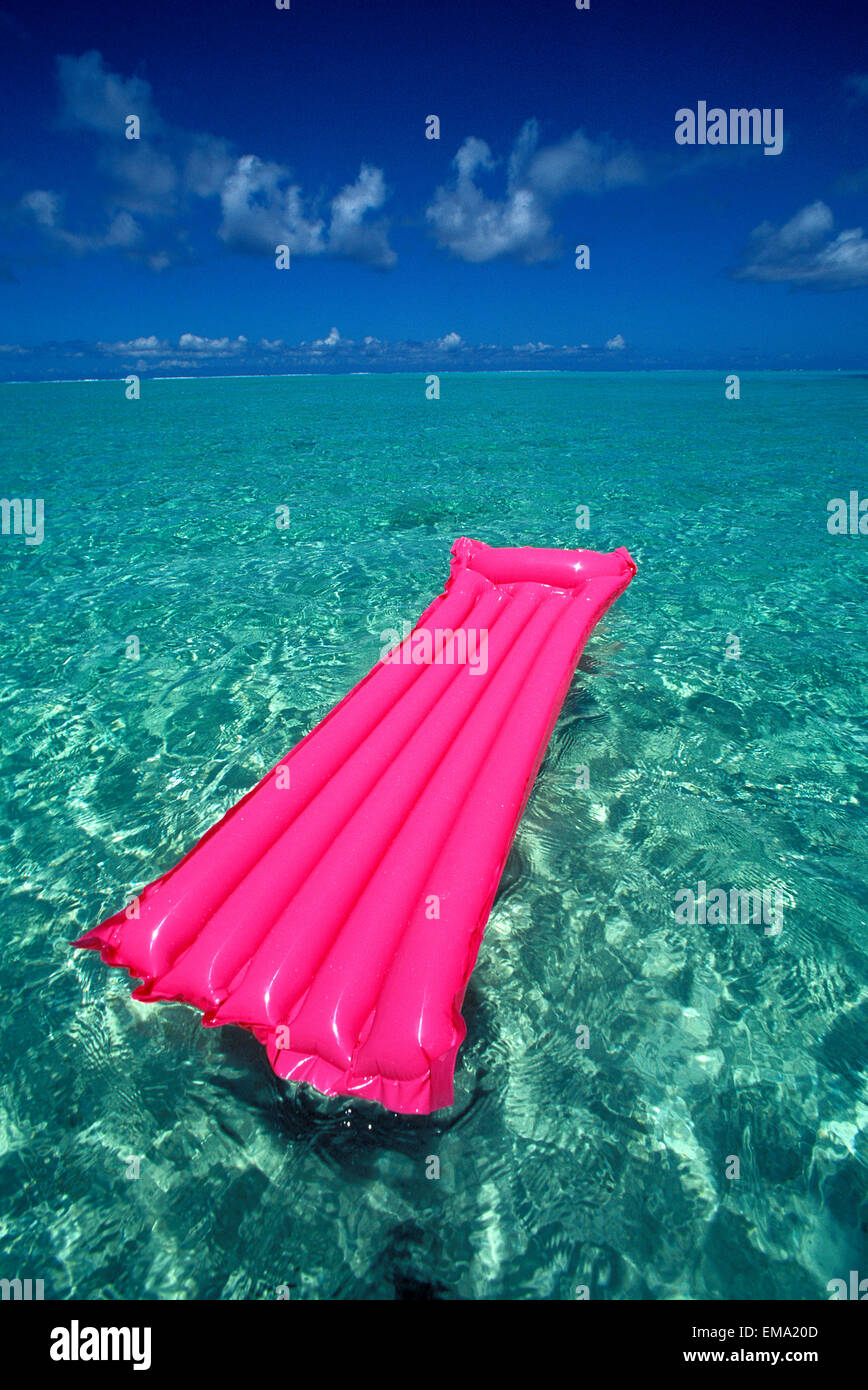 French Polynesia, Bora Bora, Pink Inflated Raft On Clear Ocean Water ...