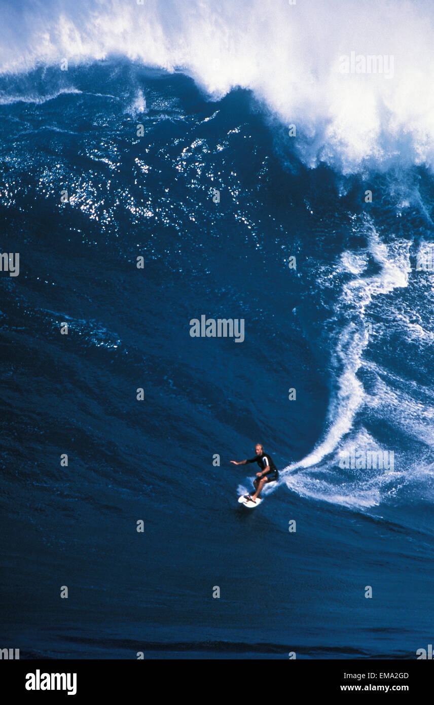 Hawaii, Maui, Distant View Of Luke Hargraves Surfing Jaws Stock Photo ...