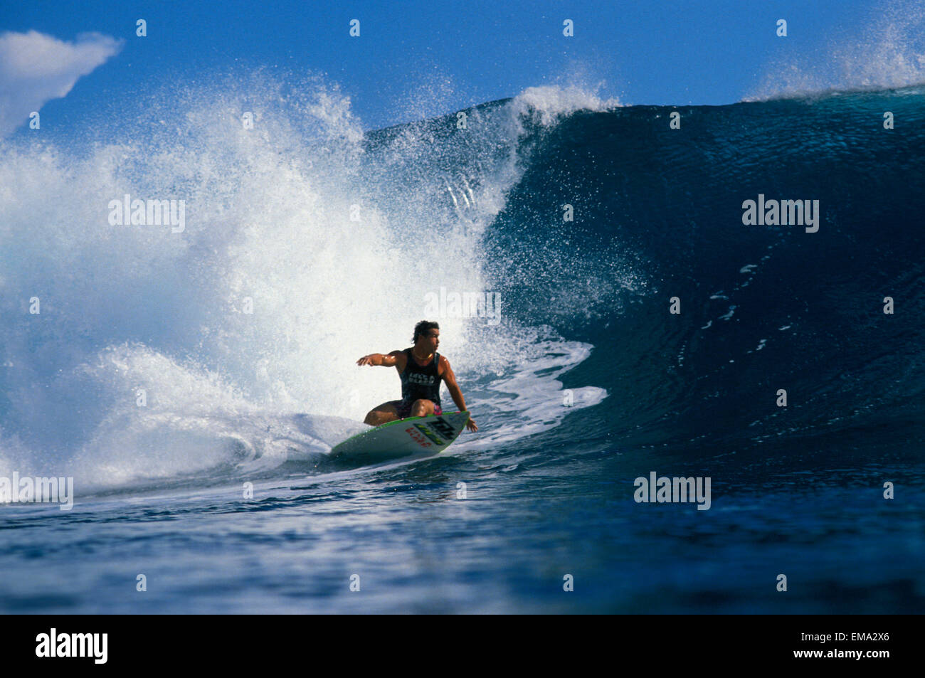 Johnny Boy Gomez, Riding A Wave, Arm Extended, Turns As Wave Curls With ...