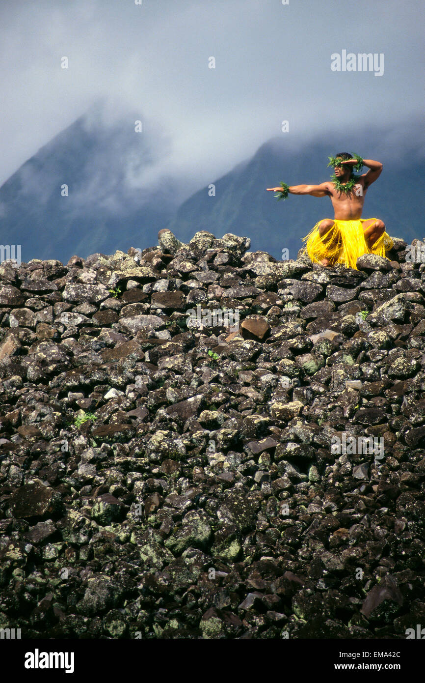 Hawaii, Kane (Male) Hula Dancer At Heiau Atop Rock Wall, Misty Sky ...