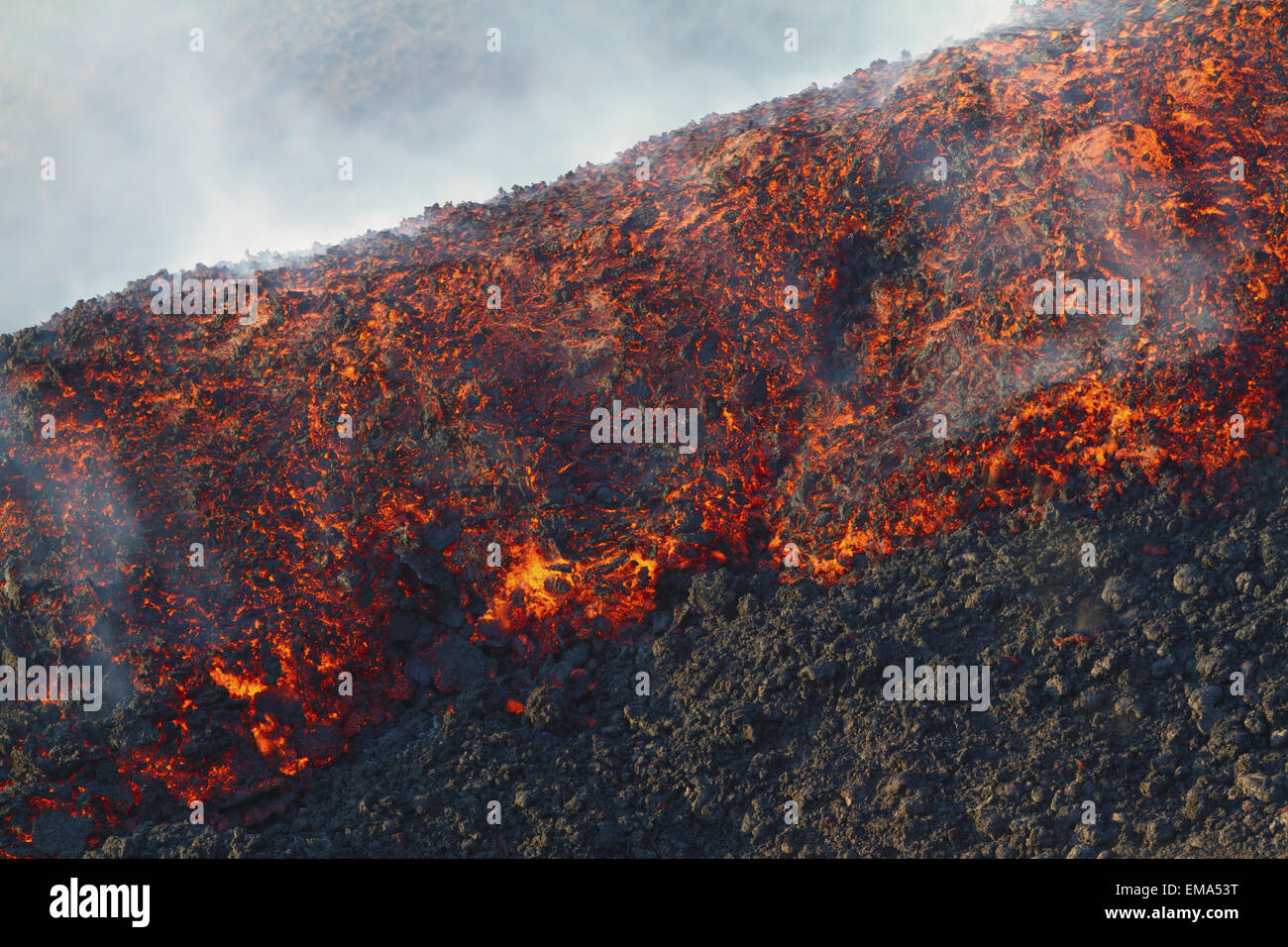 Volcano with lava flow Stock Photo - Alamy
