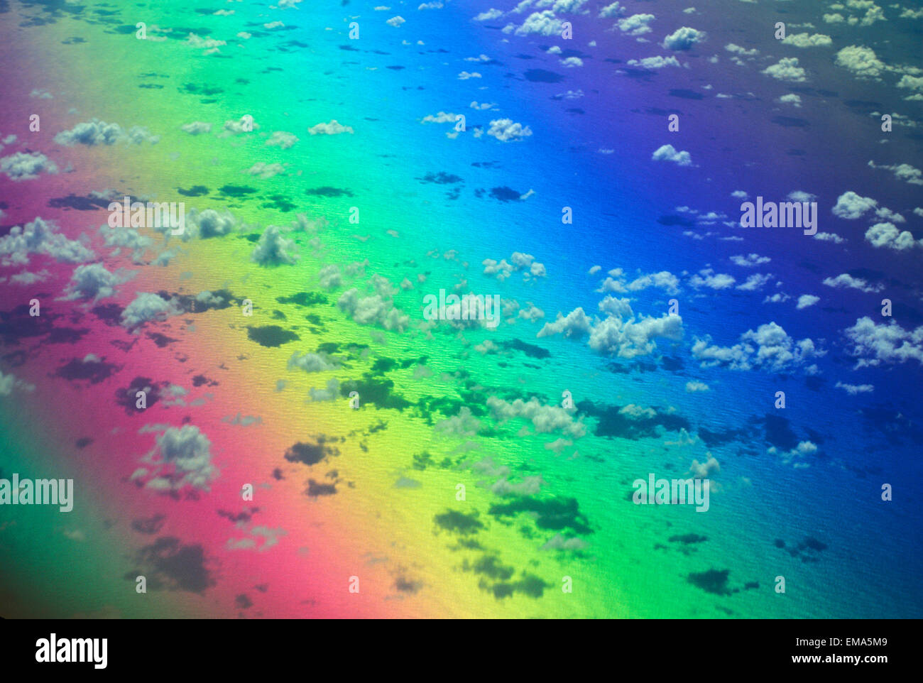 Polarized Rainbow And Aerial Of Clouds Over The Ocean Stock Photo - Alamy