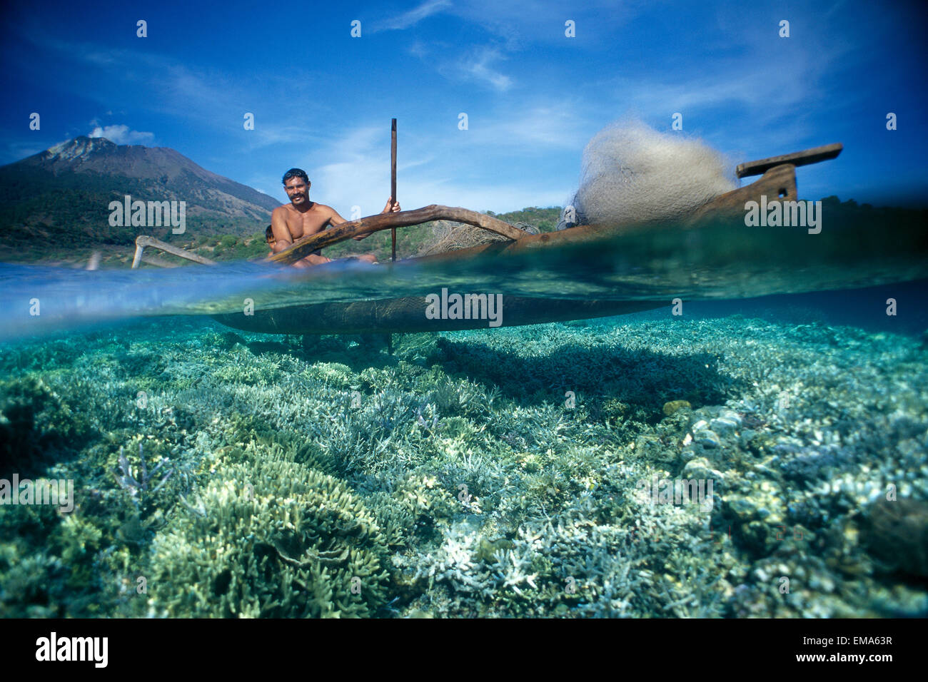 Indonesia, Bali, Fisherman In Wooden Boat, Fishing Net, Volcano ...