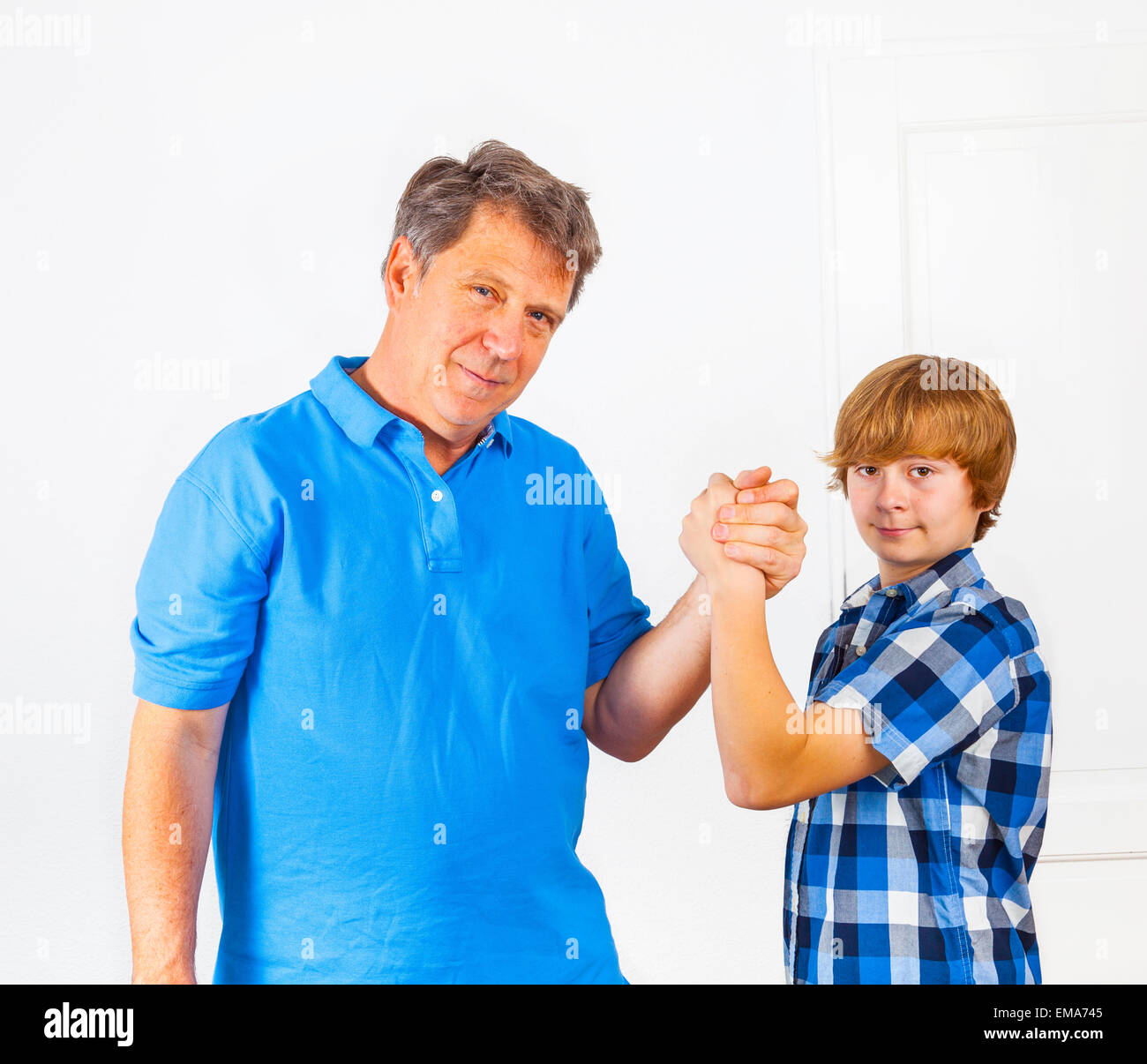 happy father and son at home clapping hands Stock Photo - Alamy